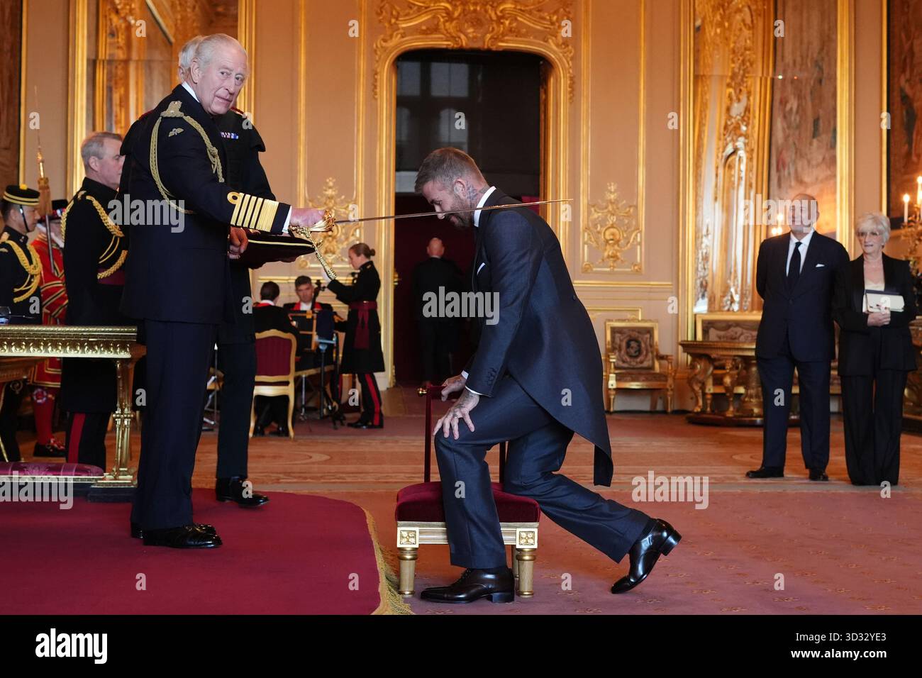 Sir David Beckham is made a Knight Bachelor by King Charles III during ...