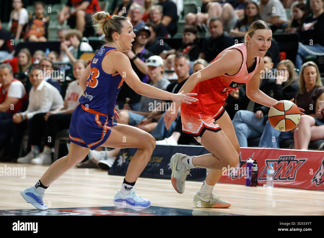 Stephanie Gorman of the Lynx drives past Abbey Ellis of the Fire during ...