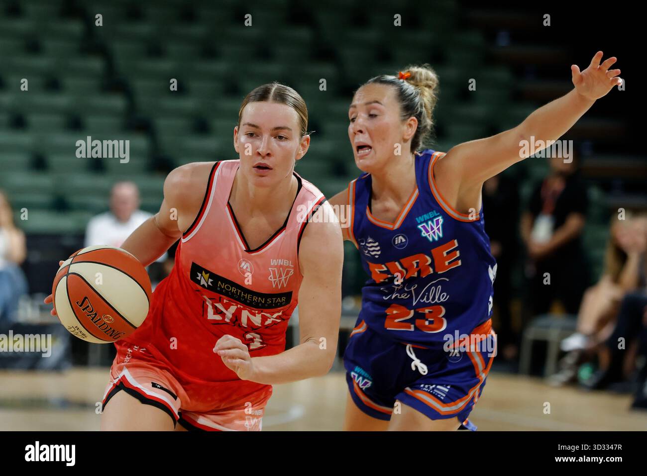 Stephanie Gorman of the Lynx drives past Abbey Ellis of the Fire during ...