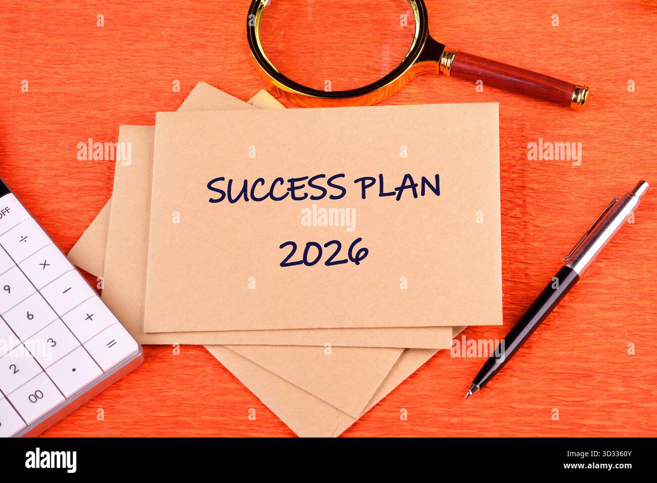 The 2026 Success Plan unfolds with a pen, a magnifying glass, and ...