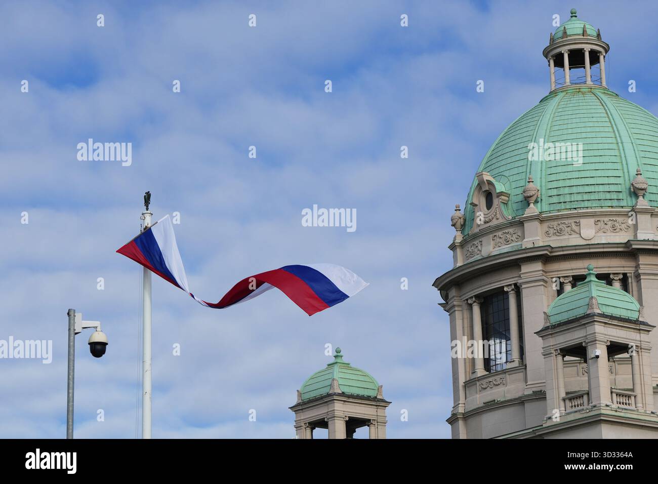 A Serbian flag waves in front of the Serbian parliament building during ...