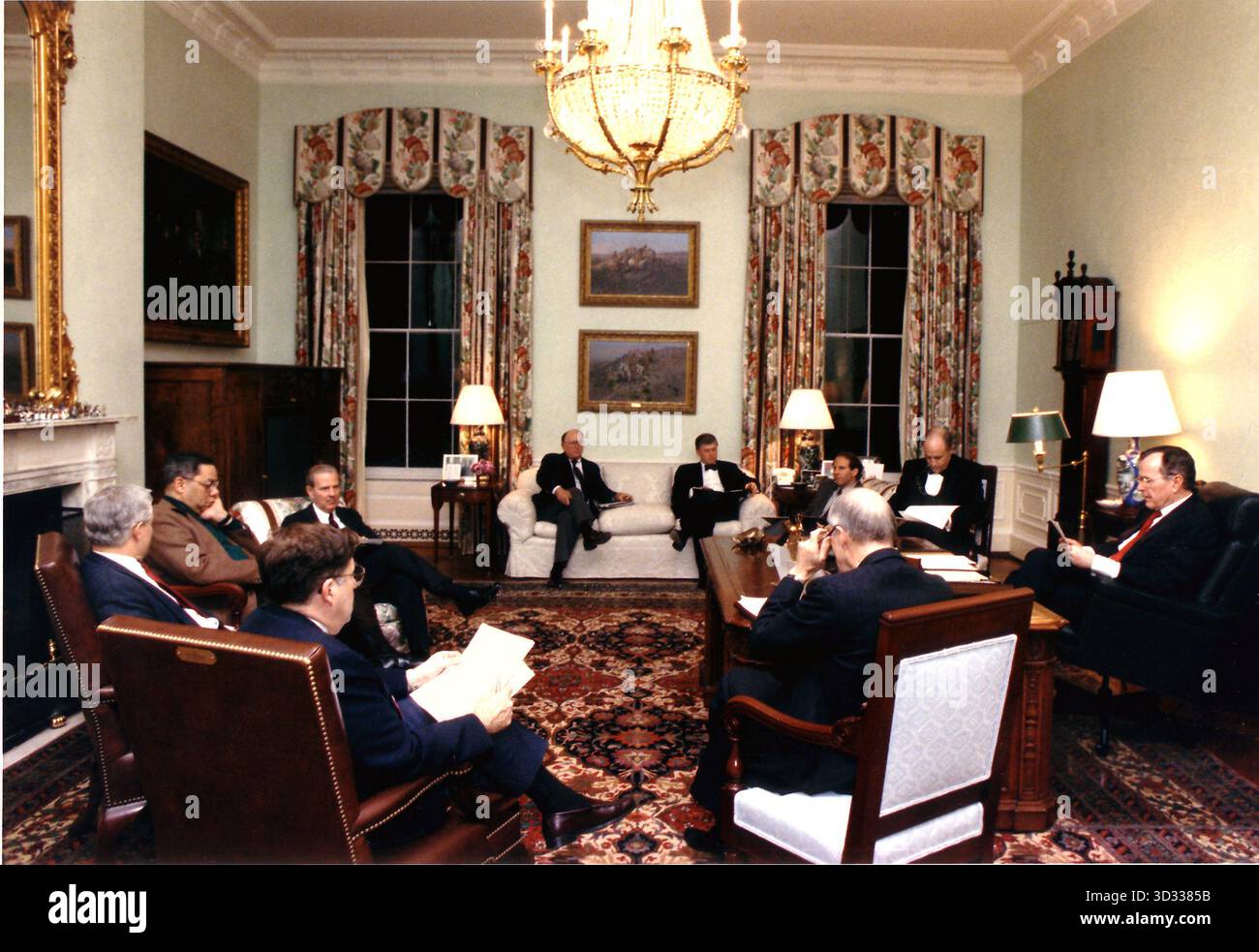 United States President George H.W. Bush, far right, meets with ...