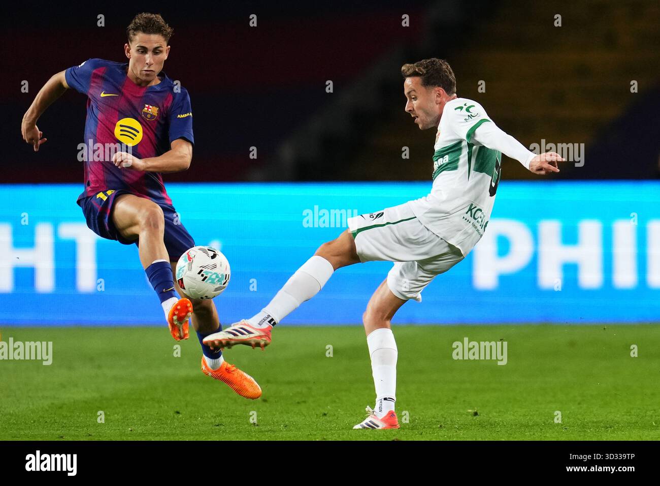 Fermin Lopez of FC Barcelona and Marc Aguado of Elche CF during the La ...