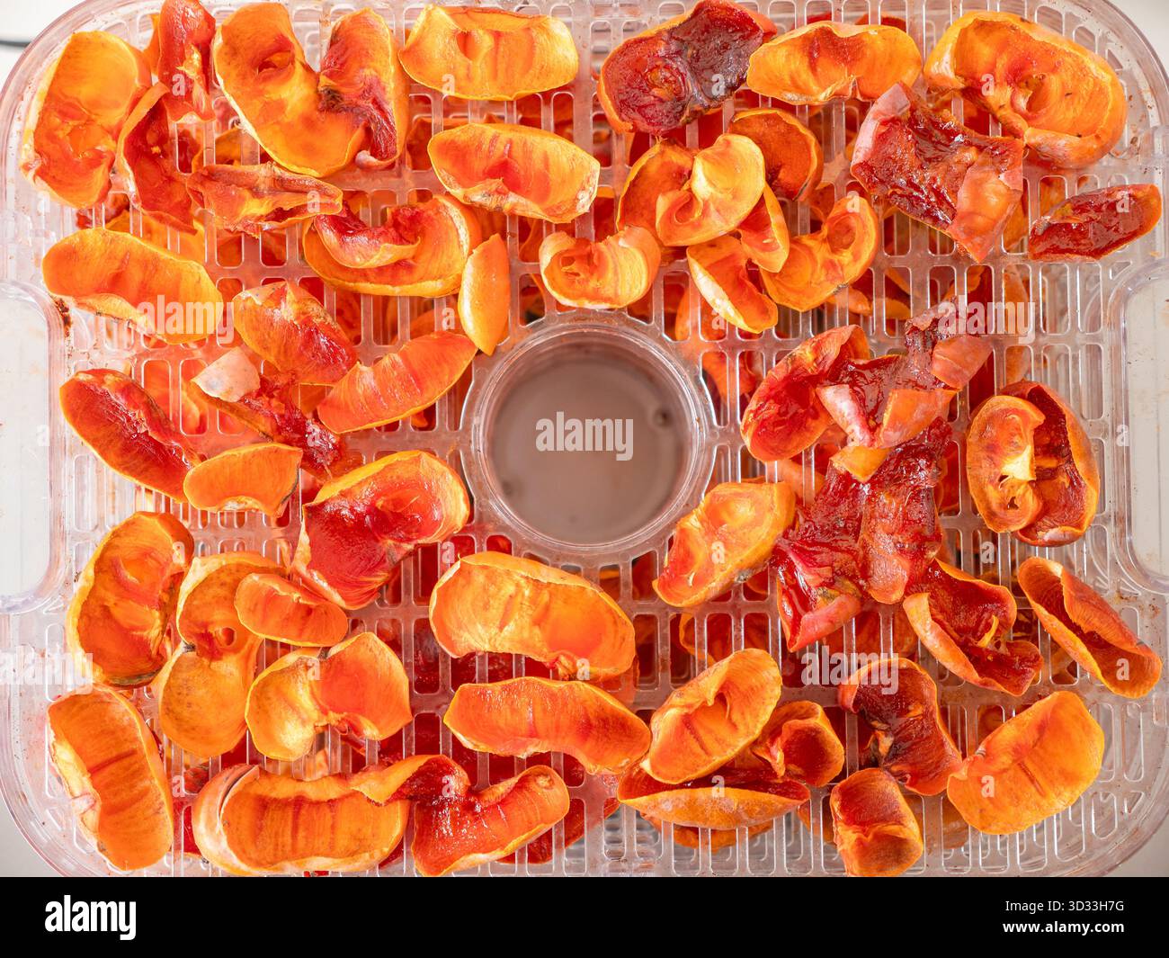 Food dehydrator drying persimmon hi-res stock photography and images ...