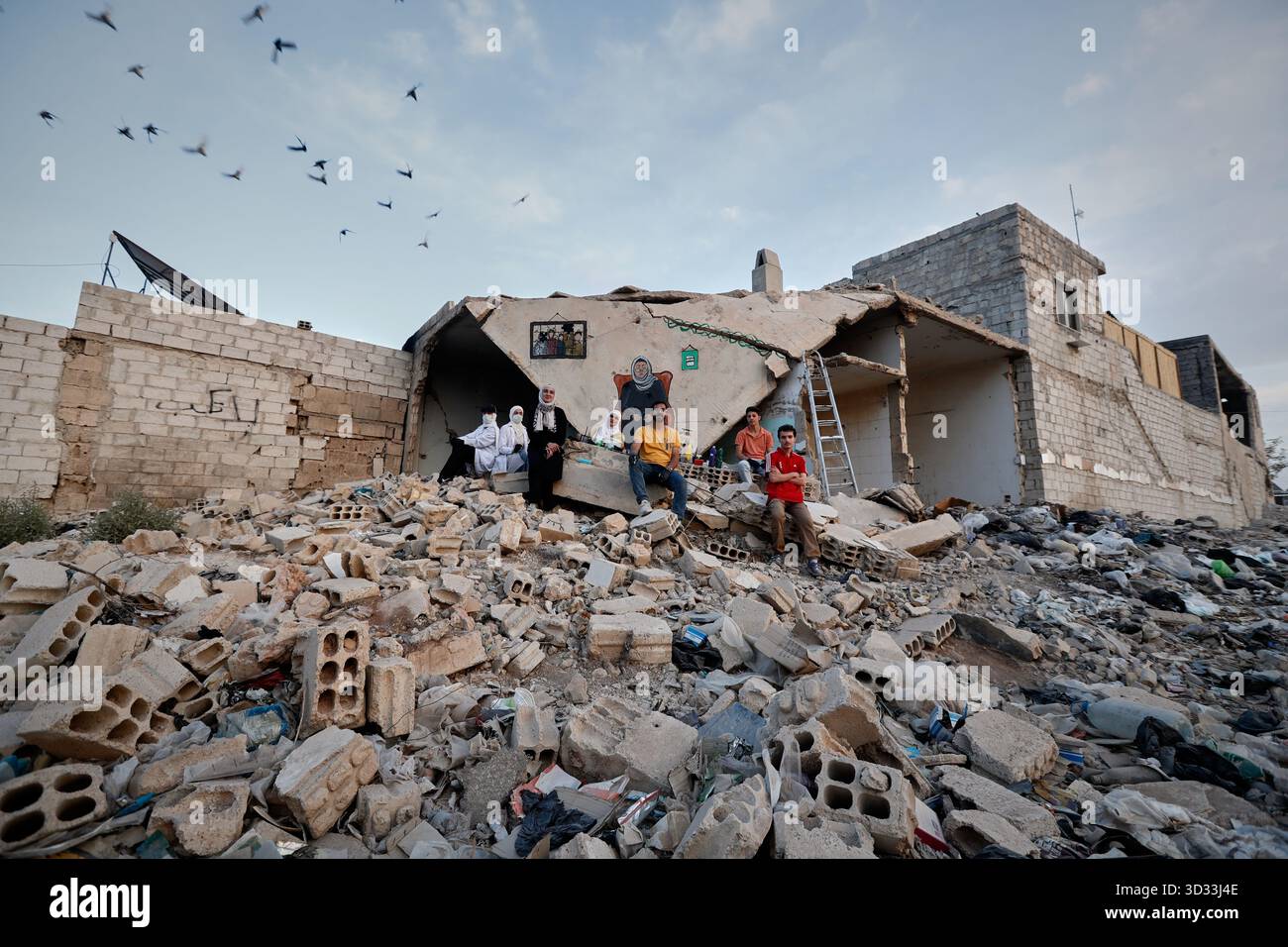 A group of Syrian graffiti artists pose for a photo after painting a ...