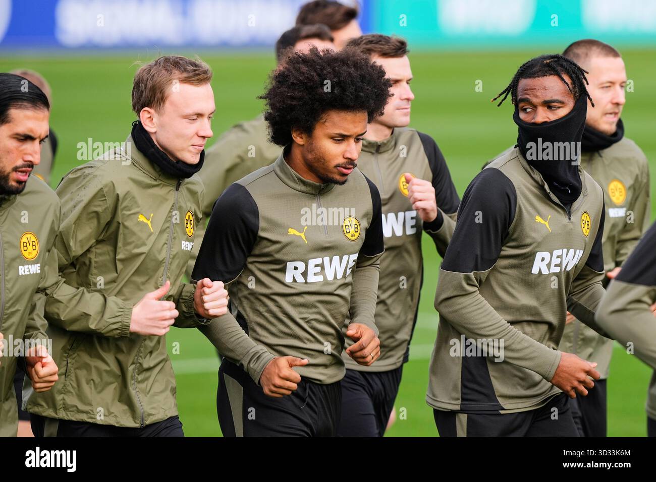 Dortmund's Karim Adeyemi, center, exercises with his teammates during a ...