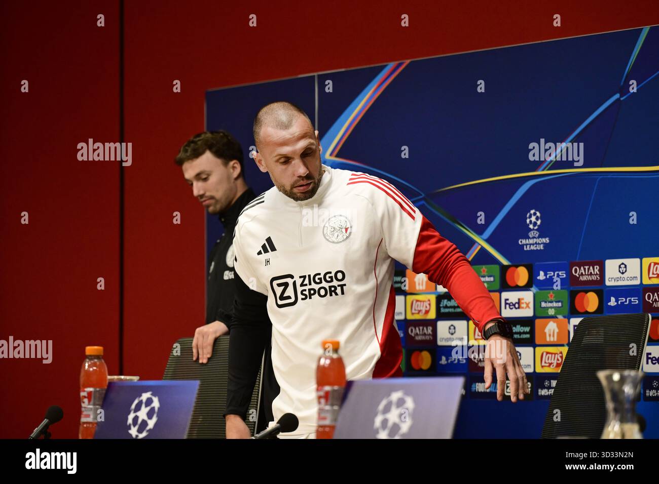 AMSTERDAM - Youri Regeer and Ajax coach Johnny Heitinga during the ...
