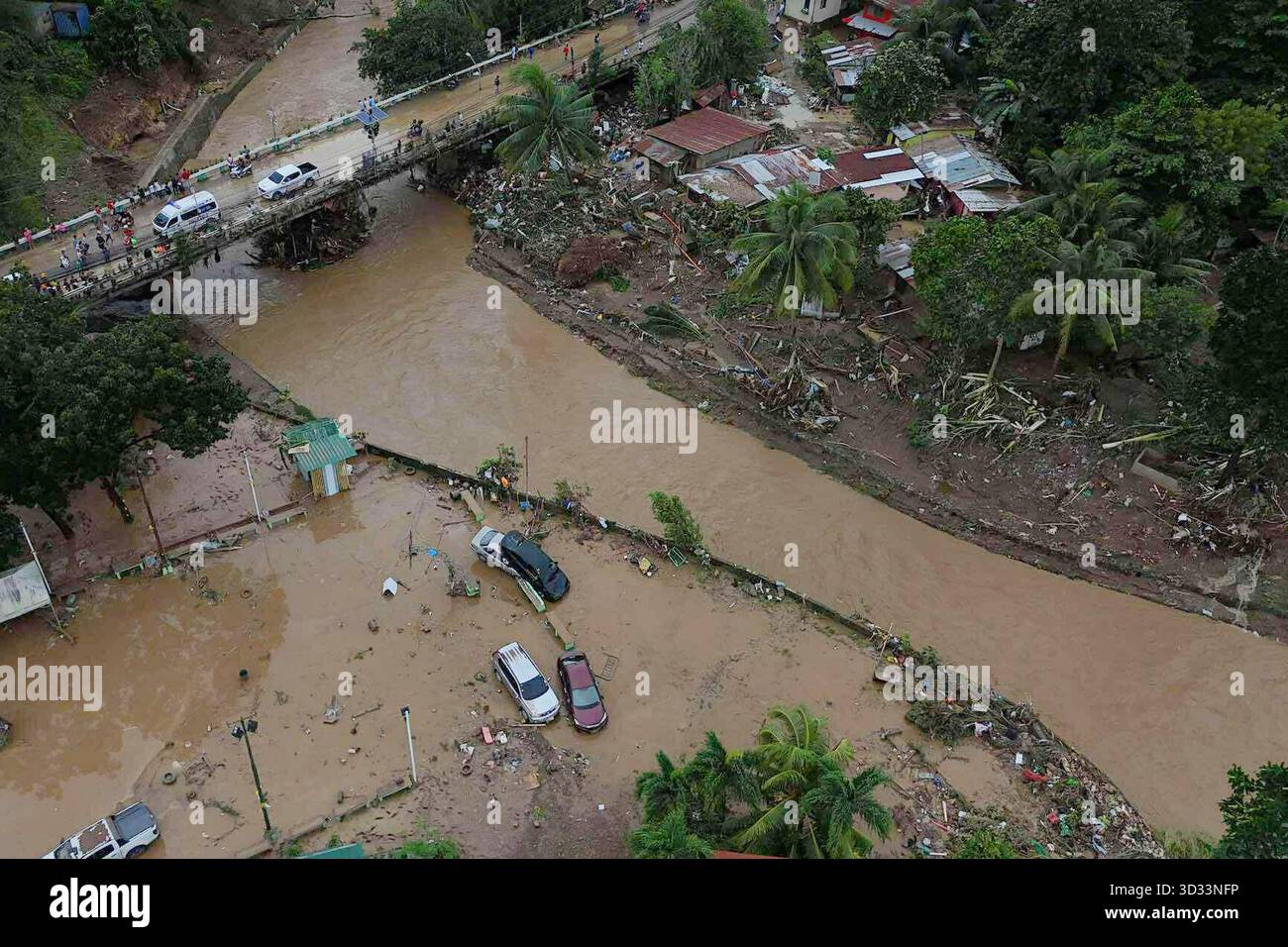 A swollen river is seen beside damages after flooding caused by Typhoon ...