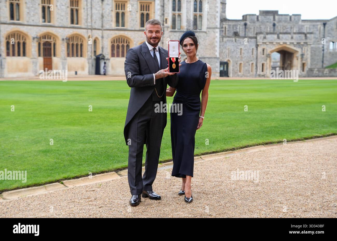 Sir David Beckham, with his wife Victoria, after he was made a Knight ...