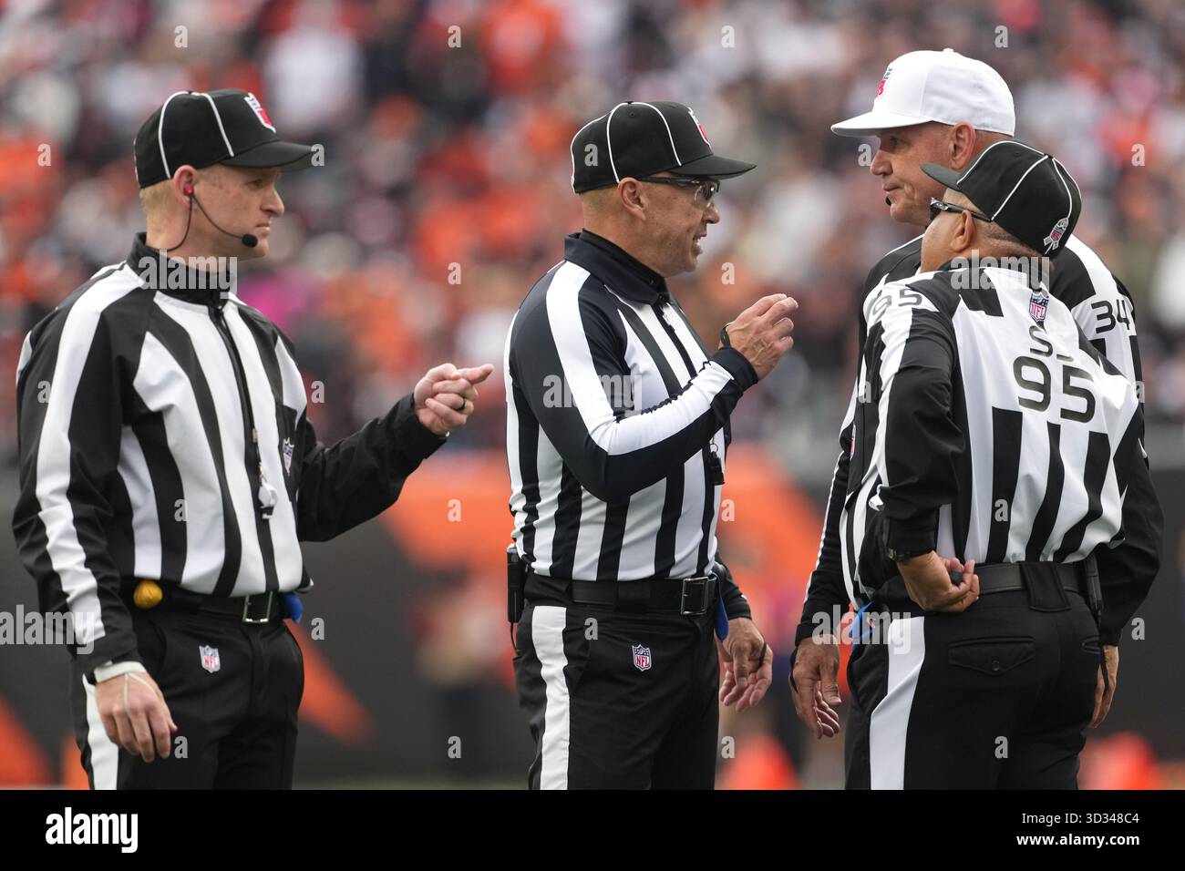 NFL Referee Clete Blakeman, second from right, talks to umpire Scott ...