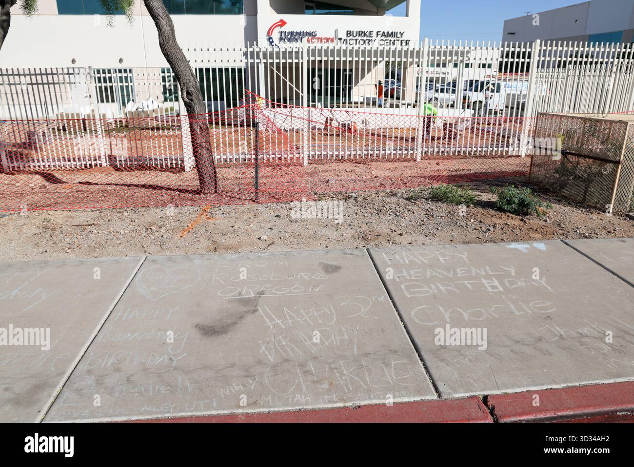 Handwritten chalk messages in memory of Charlie Kirk are in front of ...