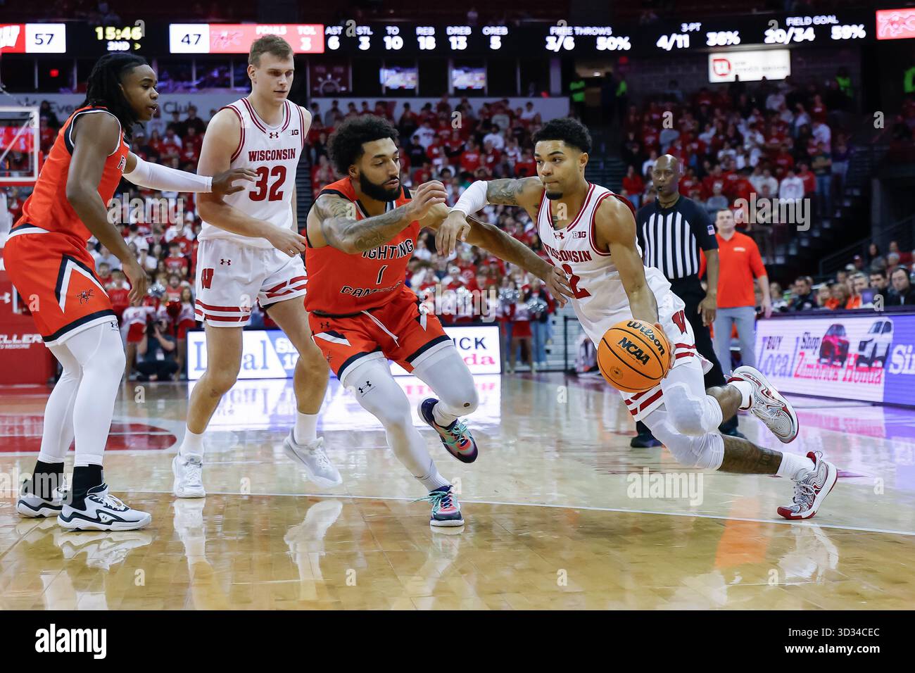 November 3, 2025: Wisconsin Badgers guard Nick Boyd (2) drives to the basket as Campbell ...