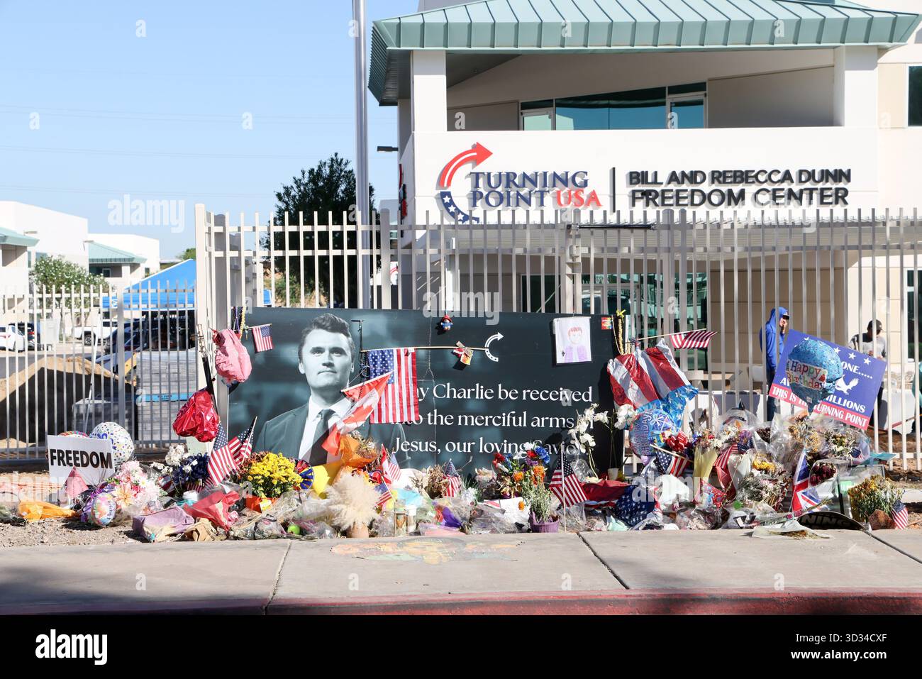 Handwritten chalk messages in memory of Charlie Kirk are in front of ...