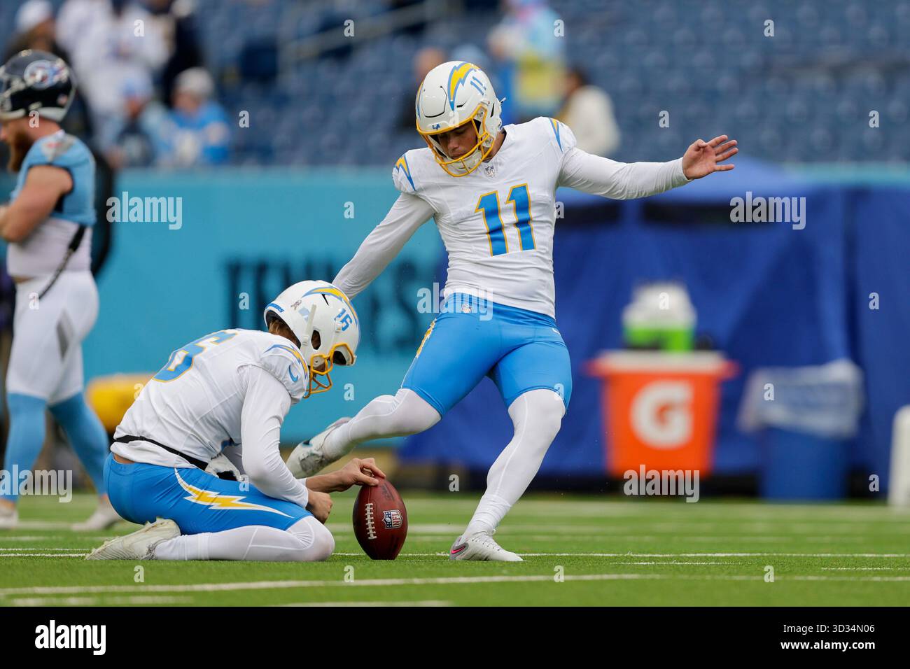 Los Angeles Chargers kicker Cameron Dicker (11) warms up as punter JK ...