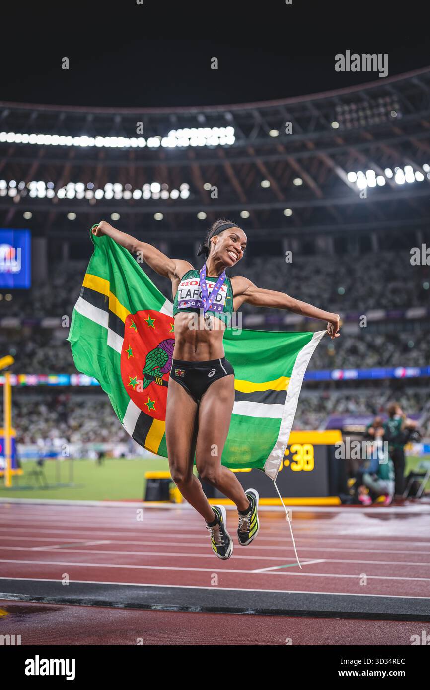 Thea Lafond celebrating her medal with her country's flag at the 2025 ...