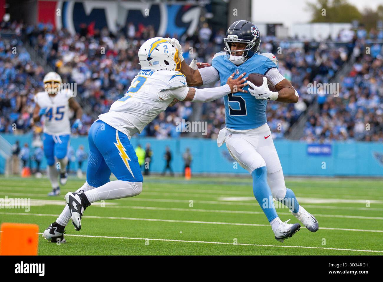 Tennessee Titans wide receiver Elic Ayomanor (5) stiff arms Los Angeles ...