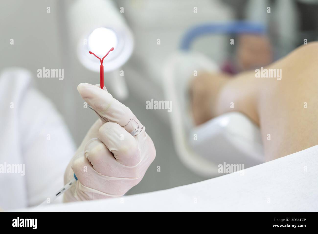 Holding an IUD birth control copper coil device in hand, used for ...
