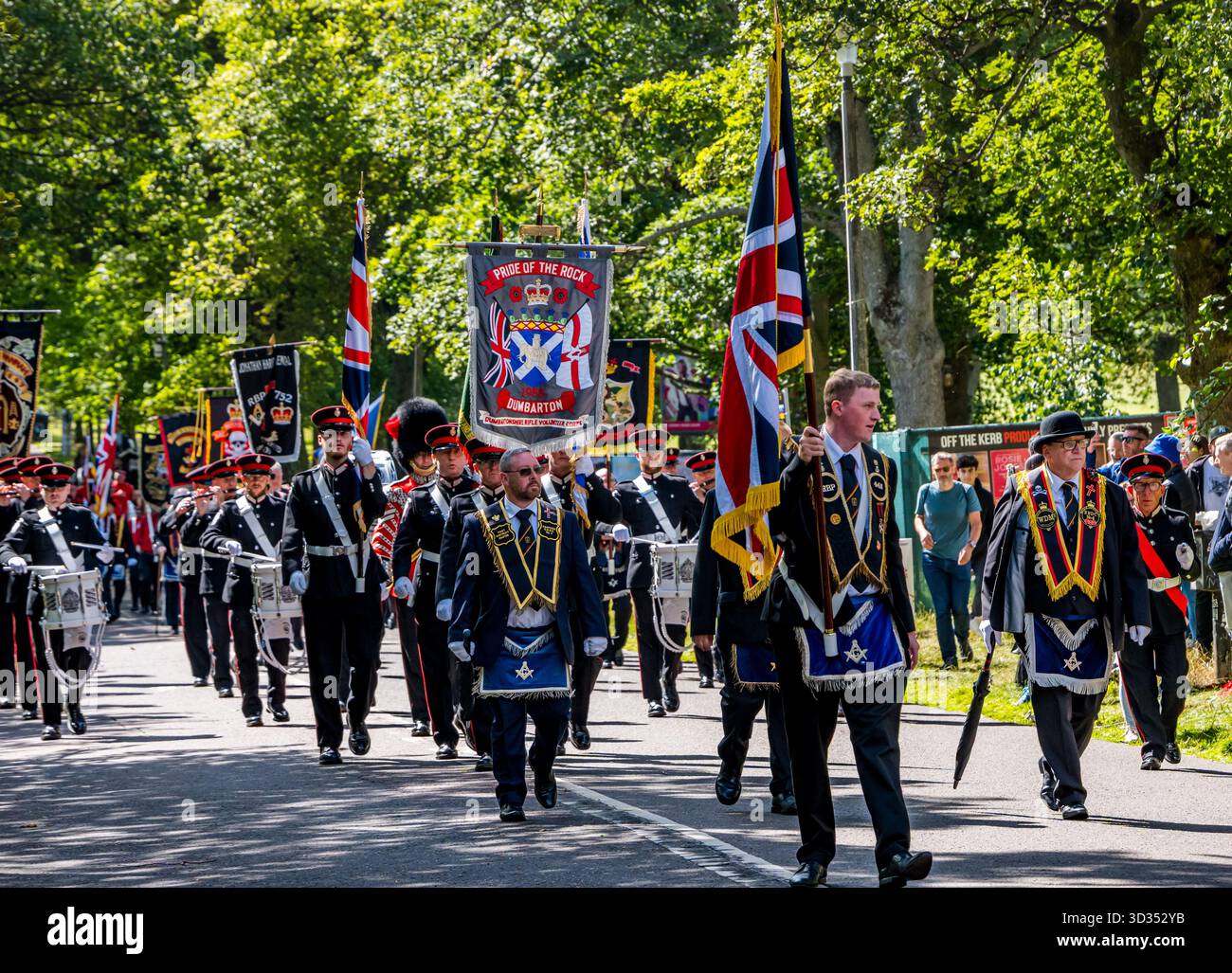 People marching wearing uniforms in Orange Order march on Middle Meadow ...
