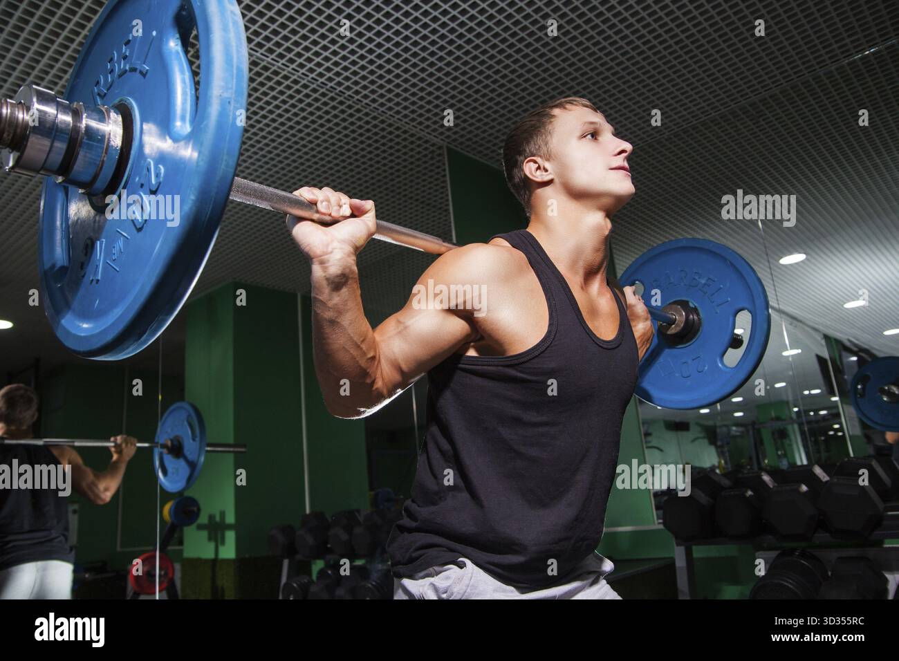 Young handsome bodybuilder doing knee hi-res stock photography and ...