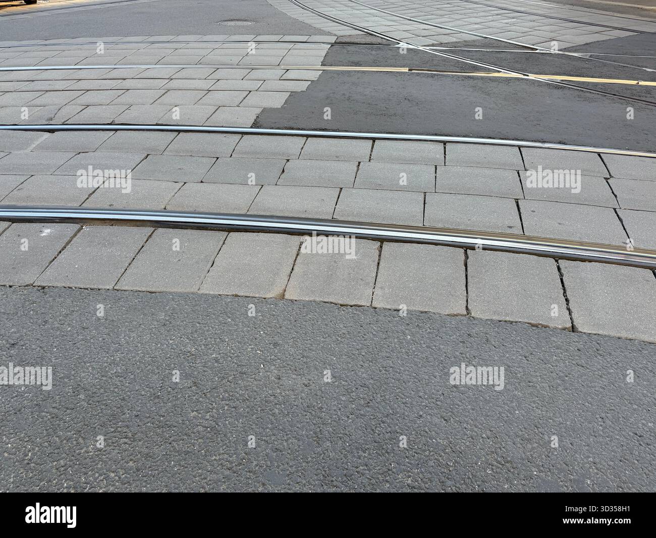 Tram tracks on city street with concrete and asphalt surface, suitable ...