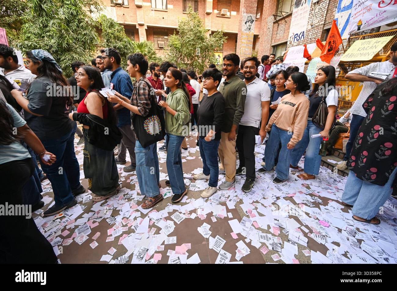 NEW DELHI, INDIA - NOVEMBER 4: Students stand in queue to cast their ...