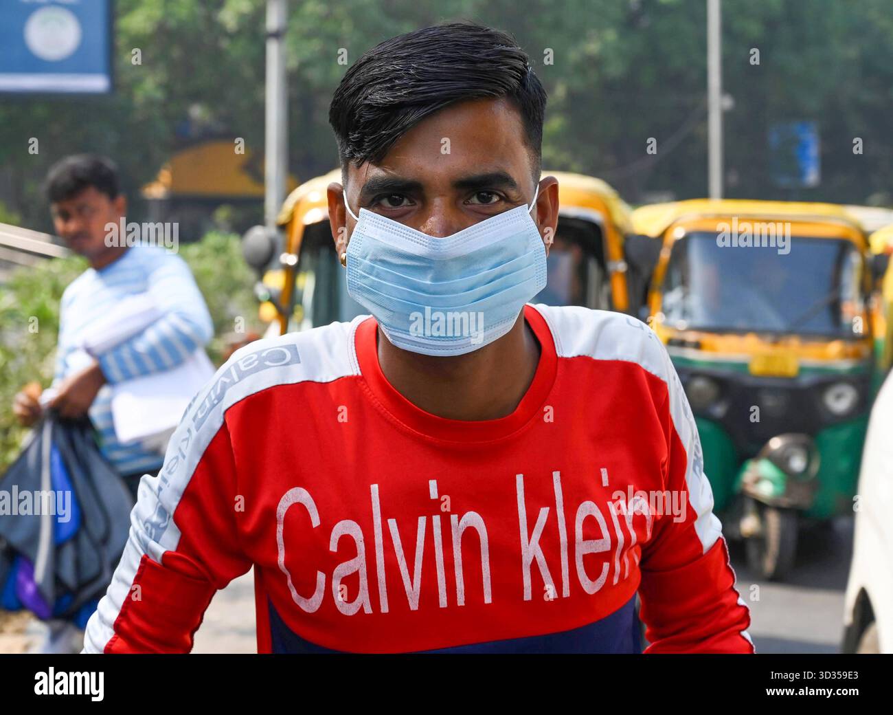 NEW DELHI, INDIA - NOVEMBER 4: People wear face masks distributed by ...