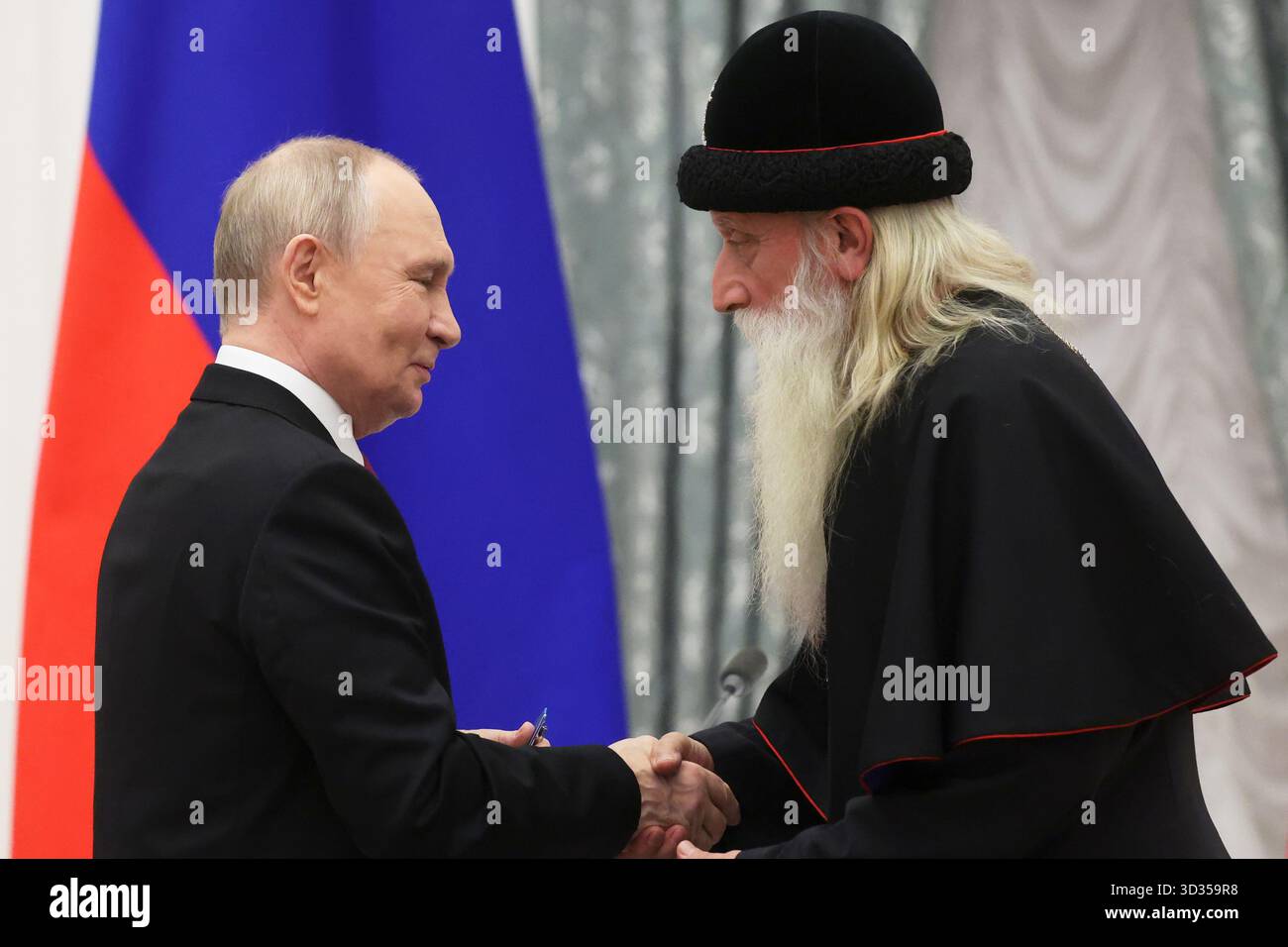 Russian President Vladimir Putin, left, awards Russian Orthodox Old ...