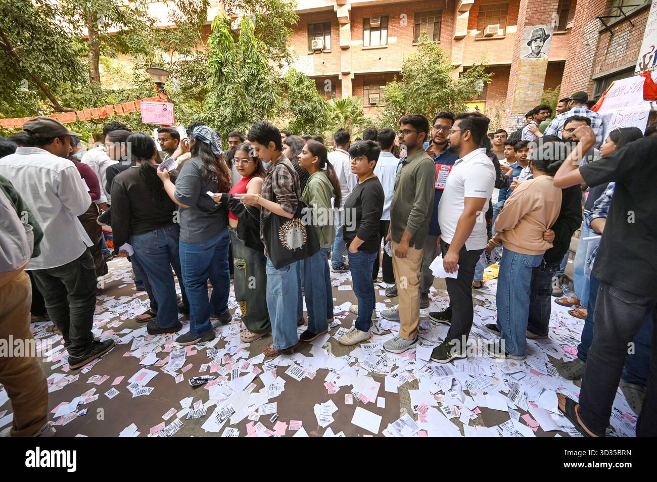 NEW DELHI, INDIA - NOVEMBER 4: Students stand in queue to cast their ...