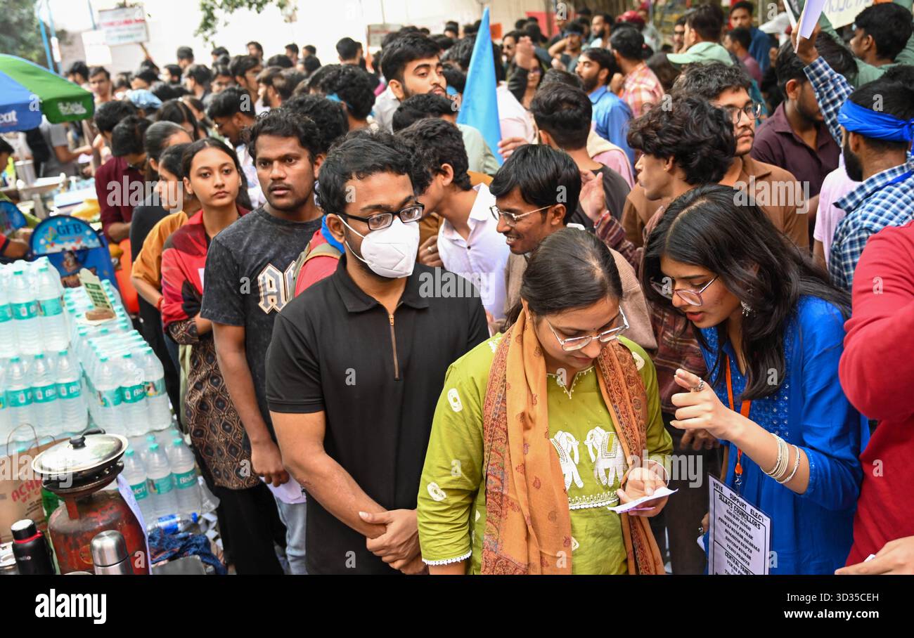 NEW DELHI, INDIA - NOVEMBER 4: Students stand in queue to cast their ...