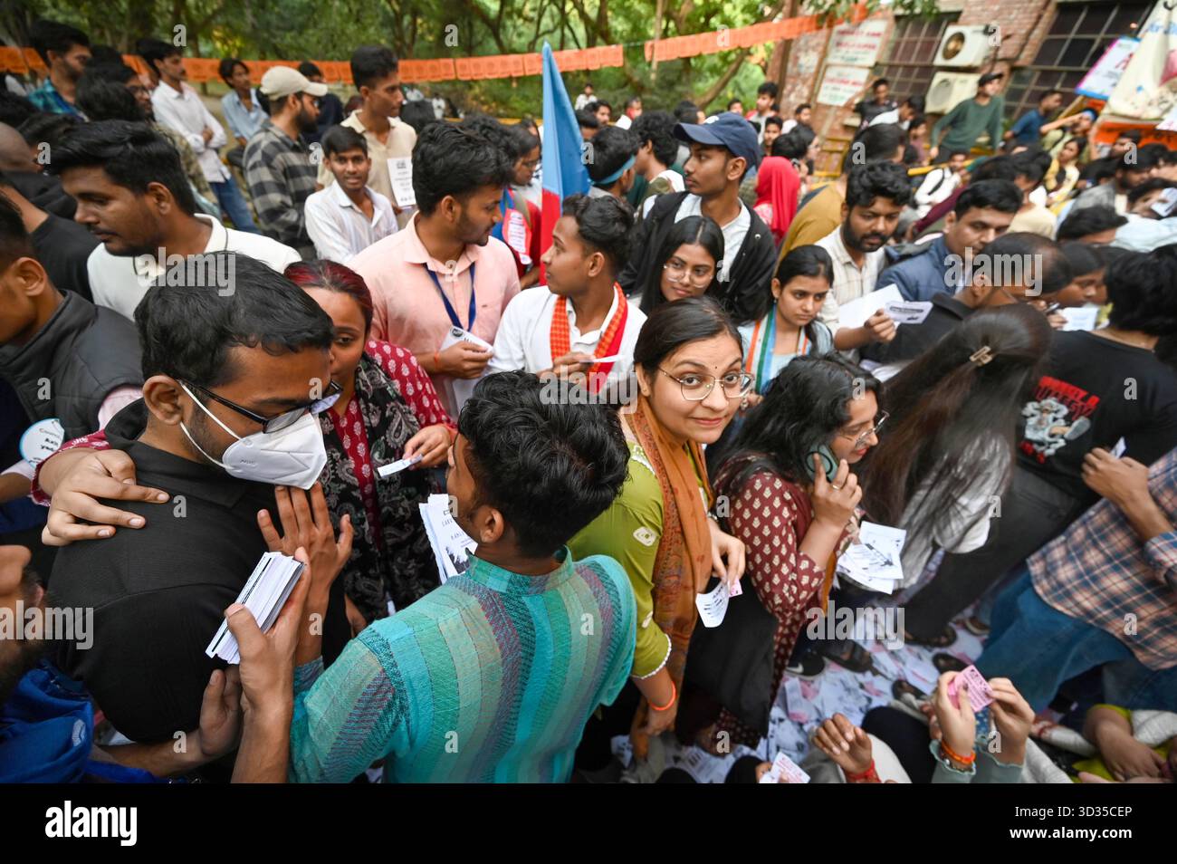 NEW DELHI, INDIA - NOVEMBER 4: Students stand in queue to cast their ...