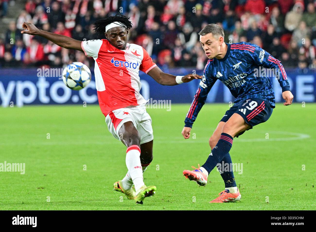 From left David Moses of Slavia, Leandro Trossard of Arsenal in action ...