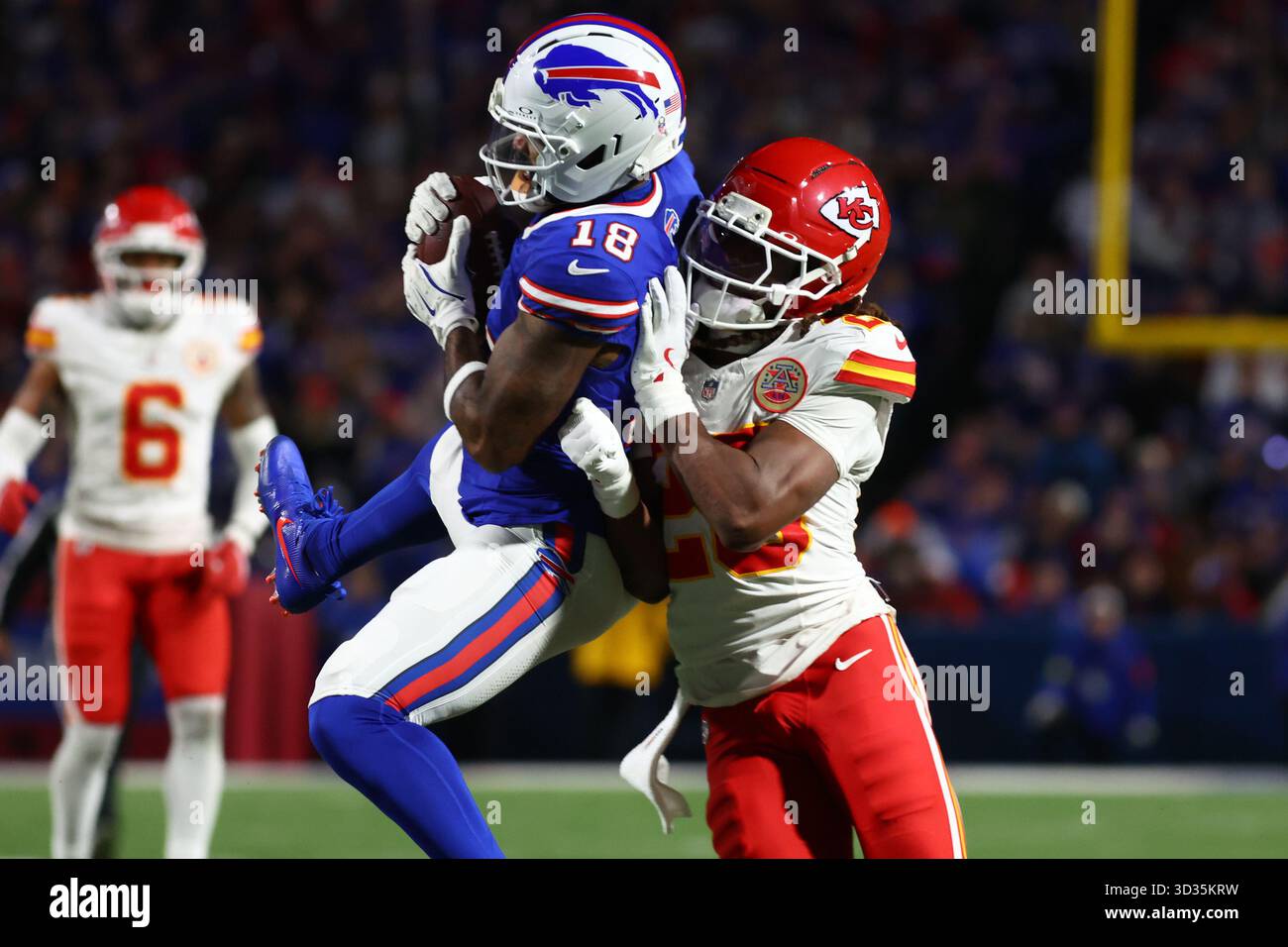 Buffalo Bills wide receiver Elijah Moore (18) is hit by Kansas City ...