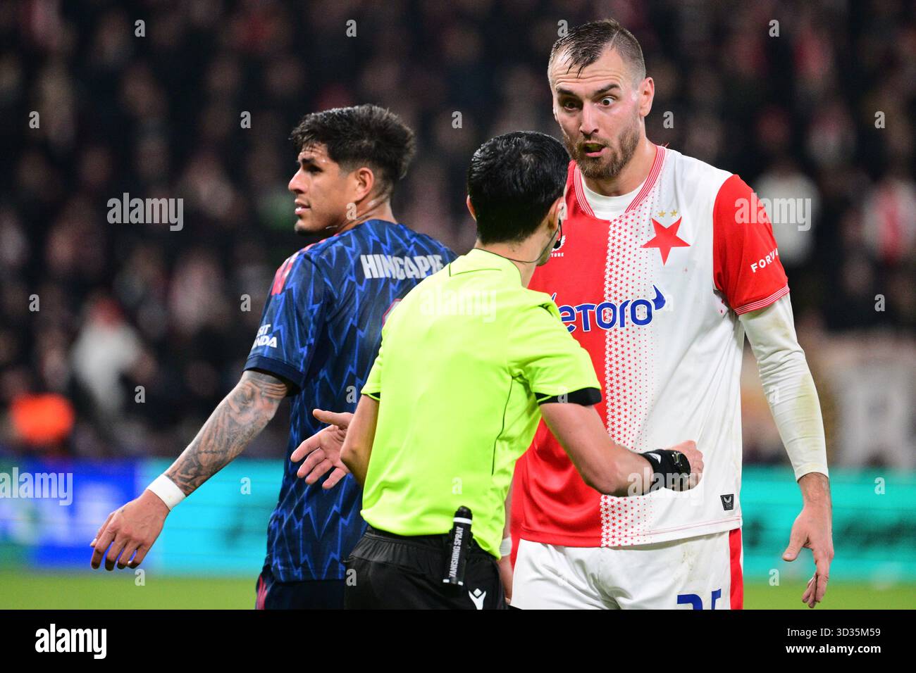 From left Piero Hincapie of Arsenal and Tomas Chory of Slavia in action ...
