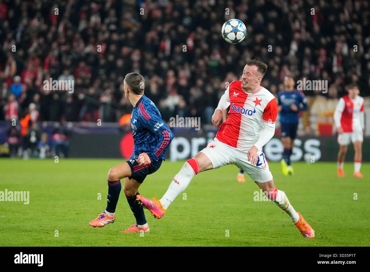 Slavia's Tomas Vlcek, right, heads the ball past Arsenal's Leandro ...