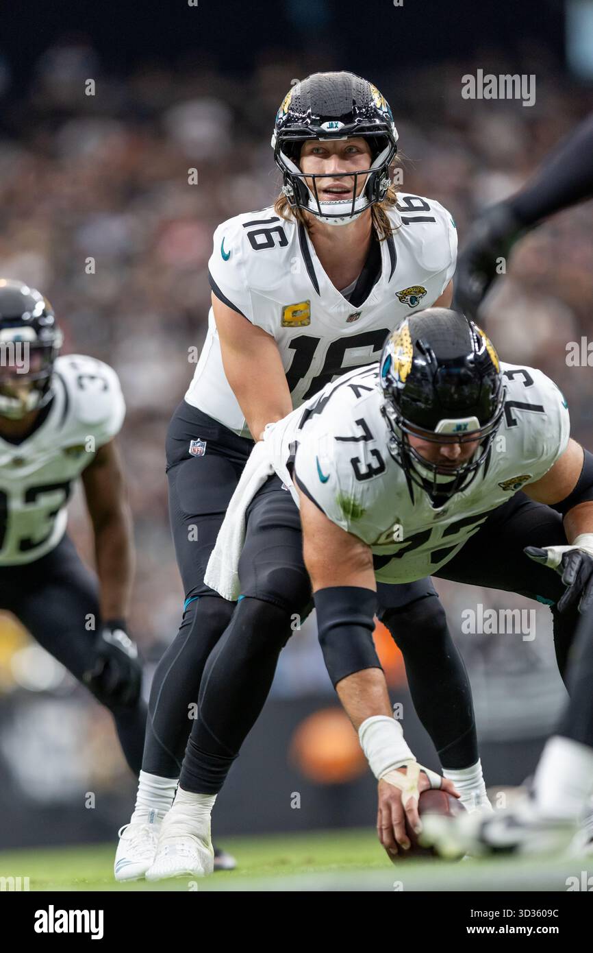 Jacksonville Jaguars quarterback Trevor Lawrence (16) lines up under ...