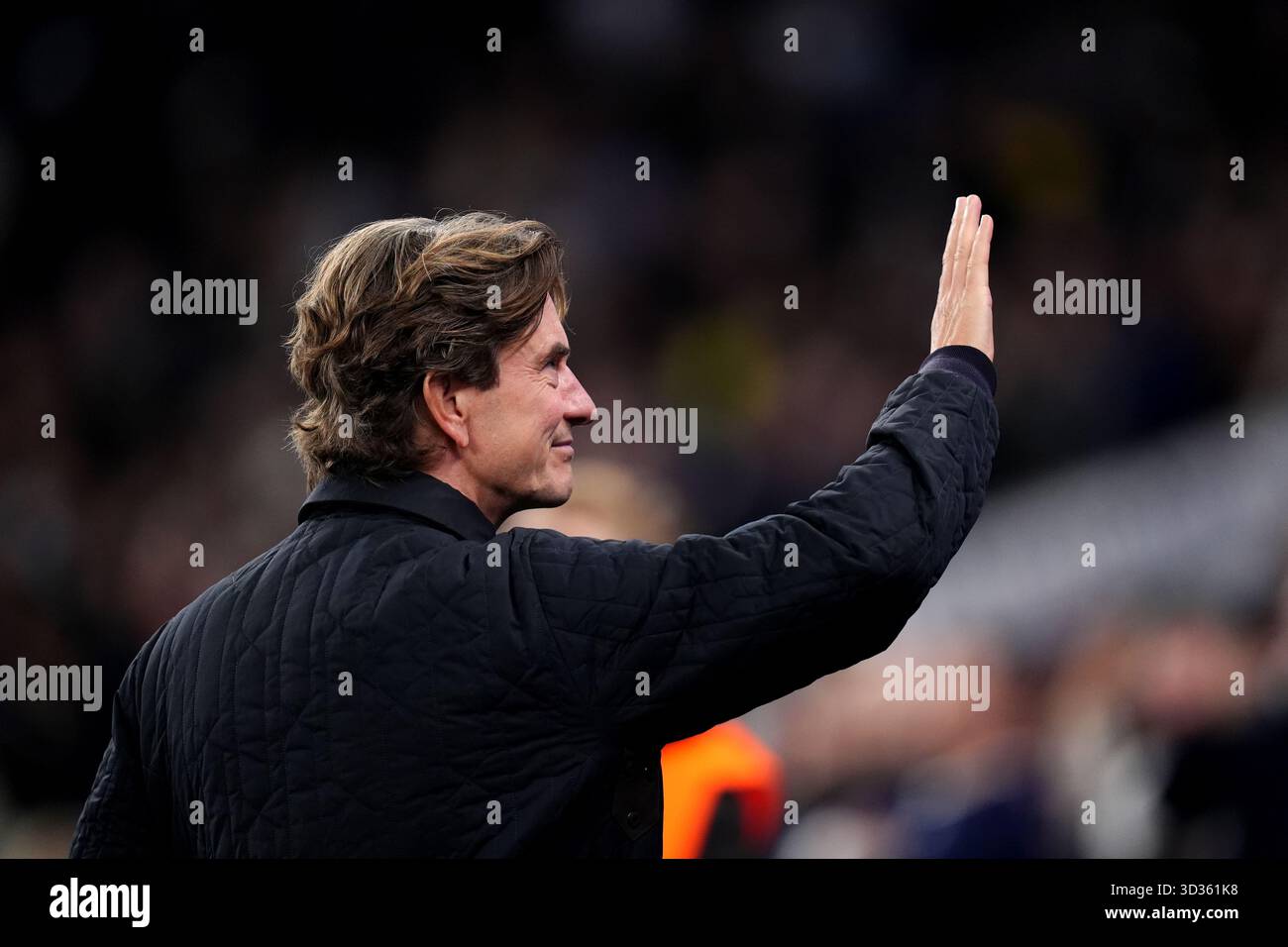 Tottenham Hotspur manager Thomas Frank salutes the fans ahead of the ...