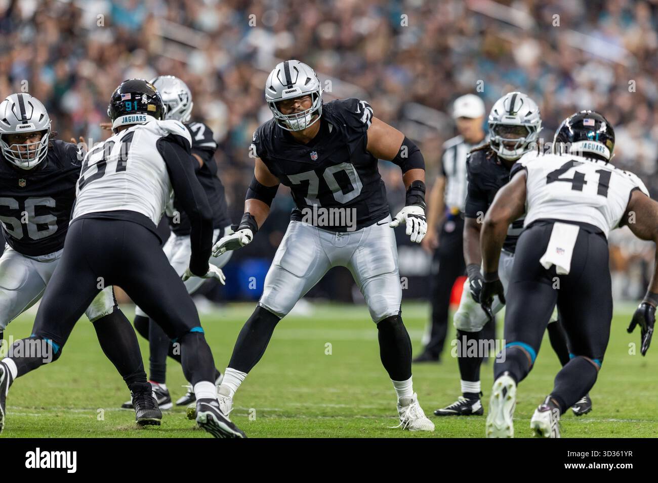 Las Vegas Raiders offensive lineman Stone Forsyth (70) blocks against ...