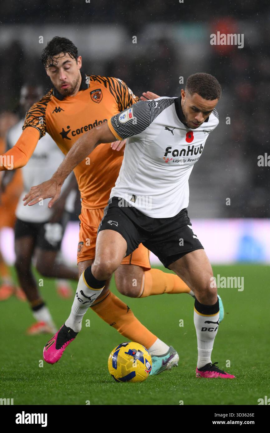 Hull City's Matt Crooks (left) and Derby County's Carlton Morris battle ...