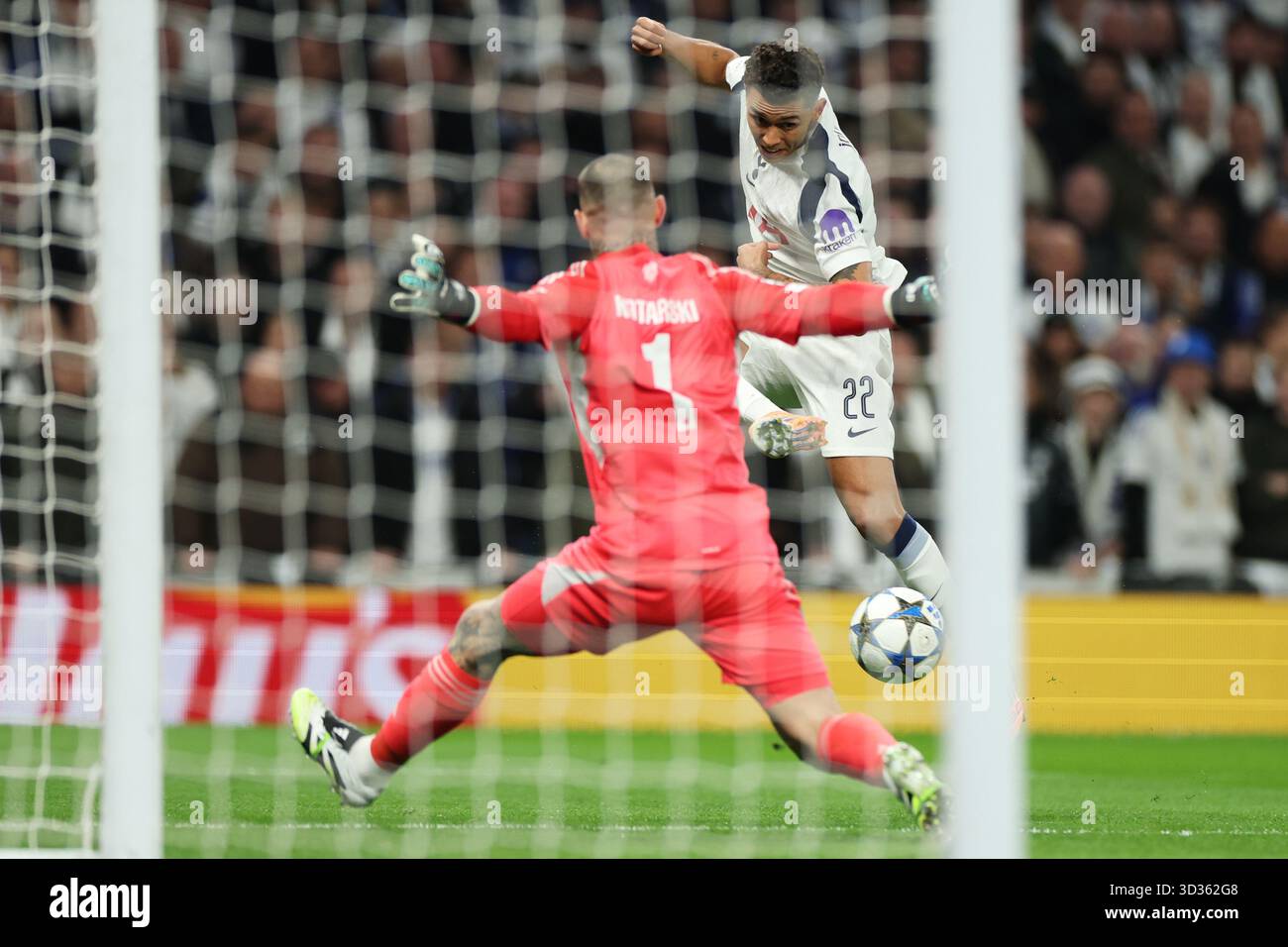 Copenhagen's goalkeeper Dominik Kotarski, front, makes a save in front ...