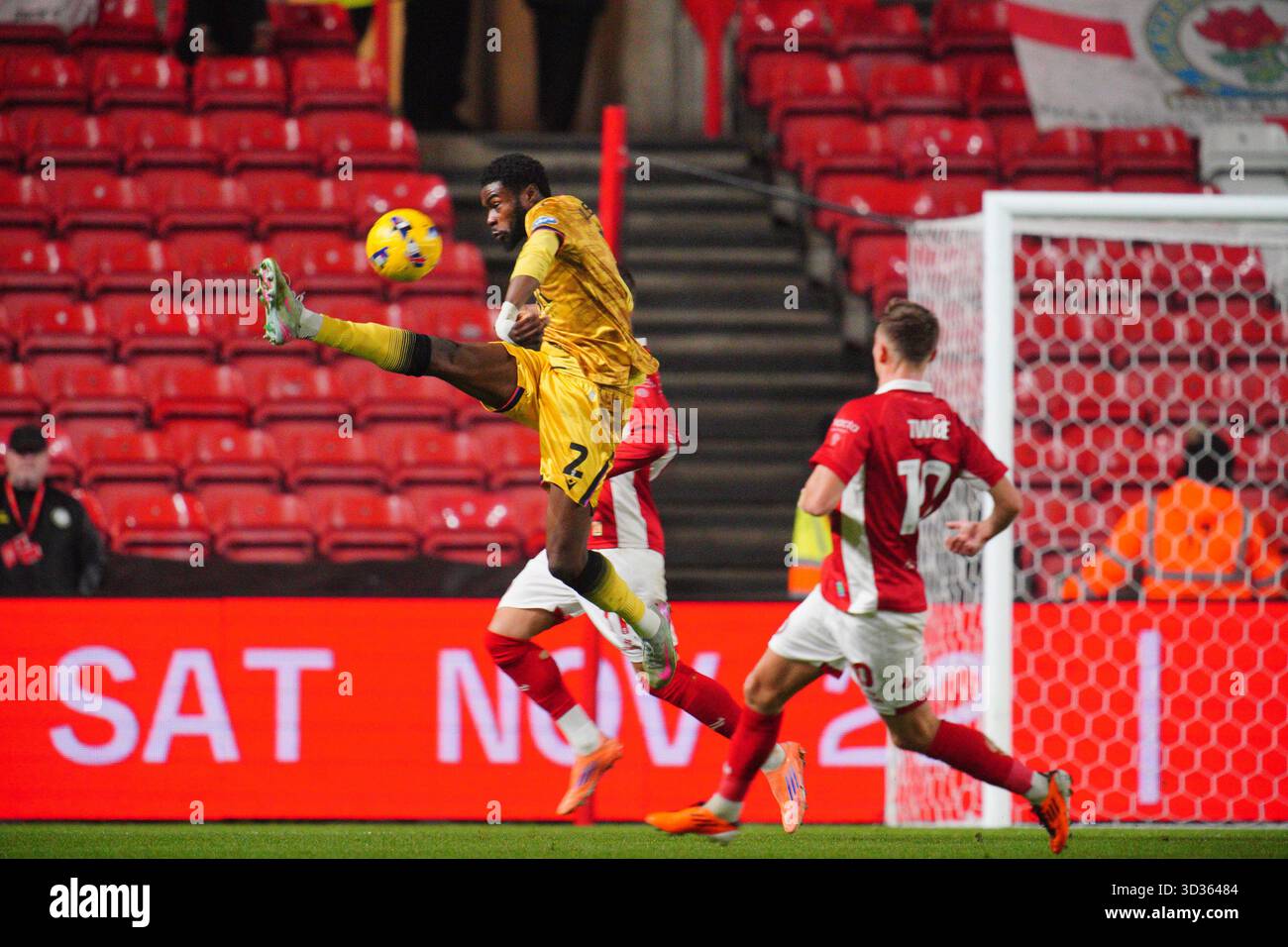 Blackburn Rovers' Ryan Alebiosu (left) clears the ball during the Sky ...