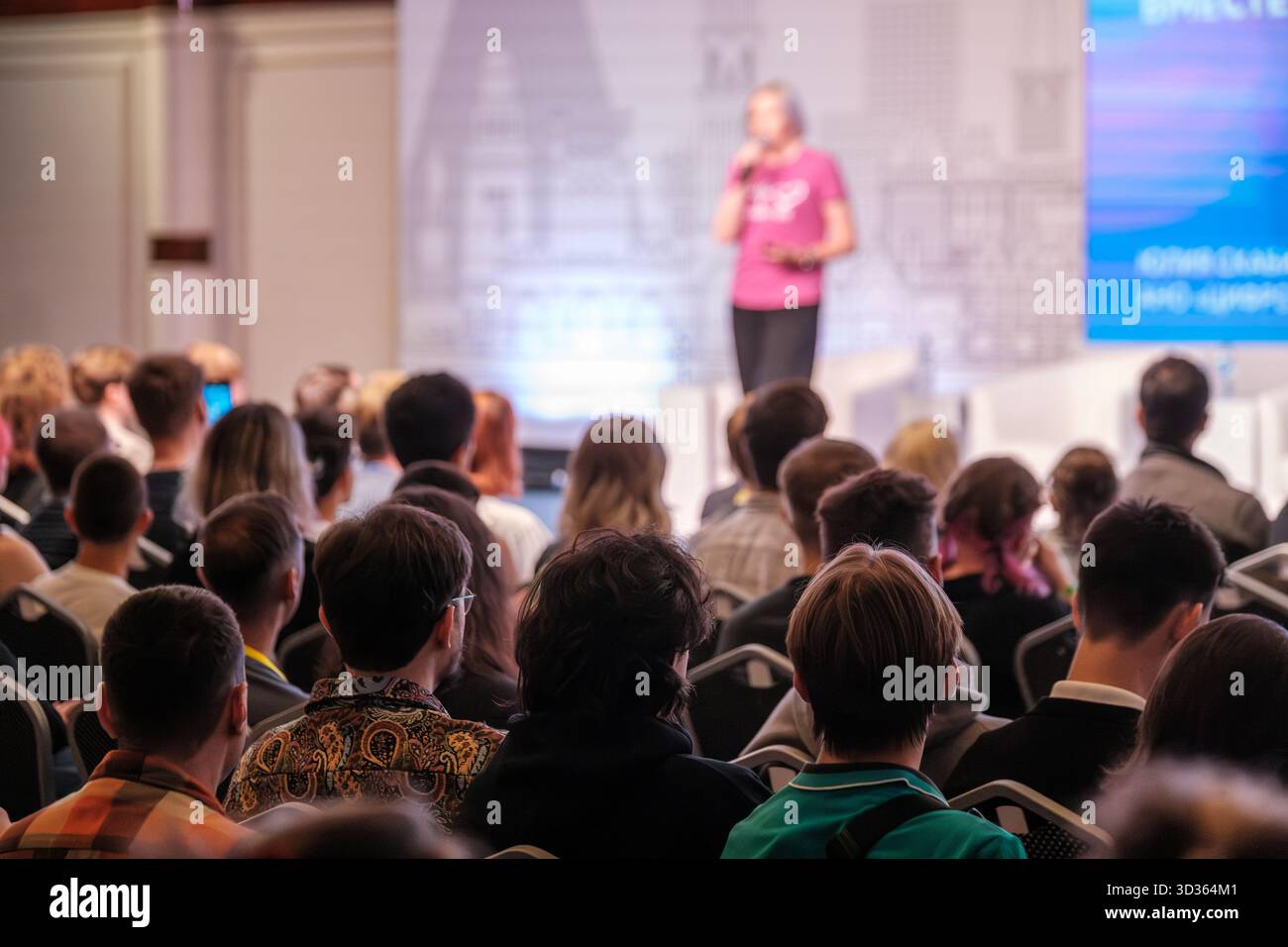 Attendees seated in conference hall hi-res stock photography and images ...