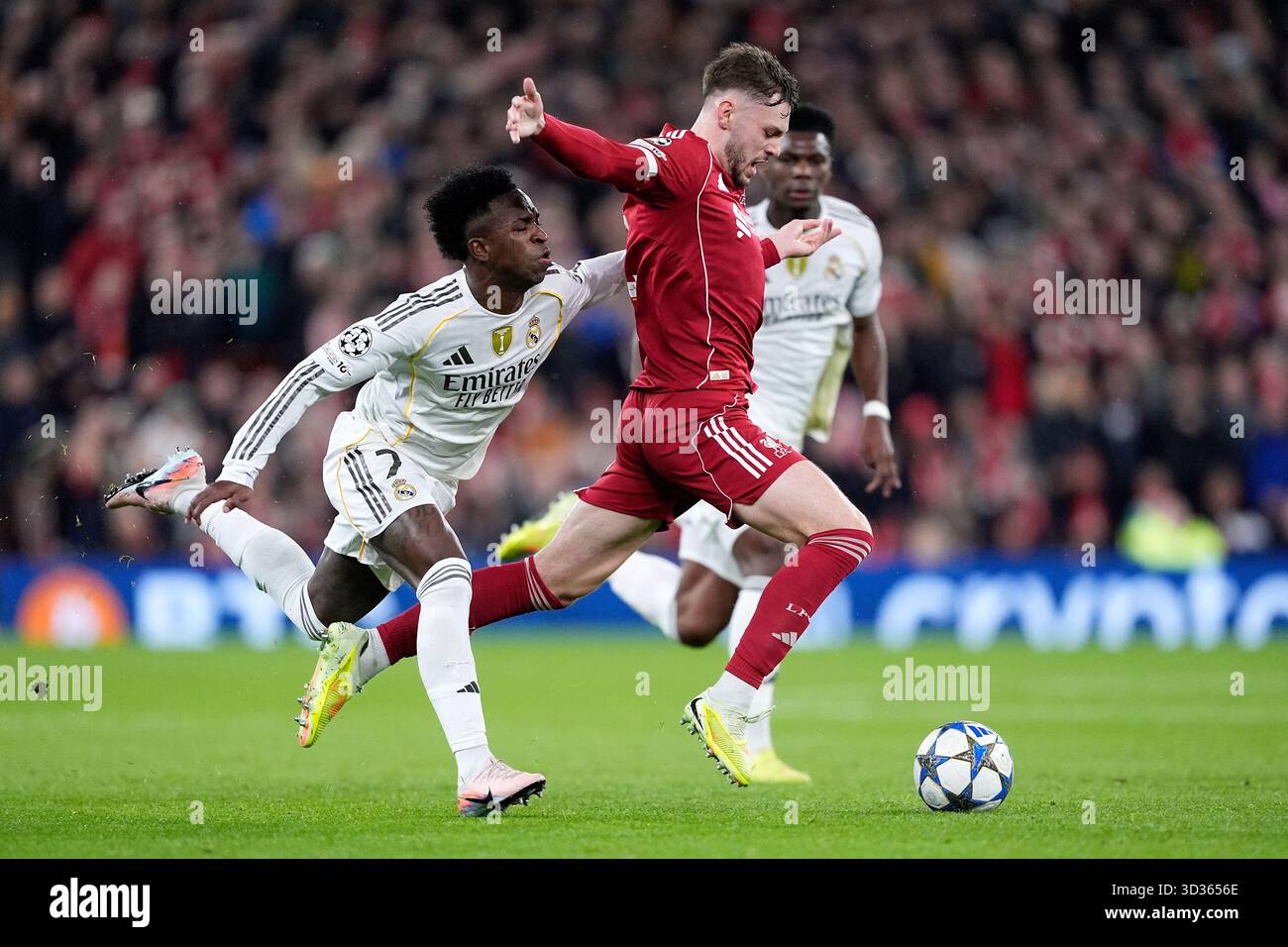Liverpool's Conor Bradley (right) is fouled by Real Madrid's Vinicius ...