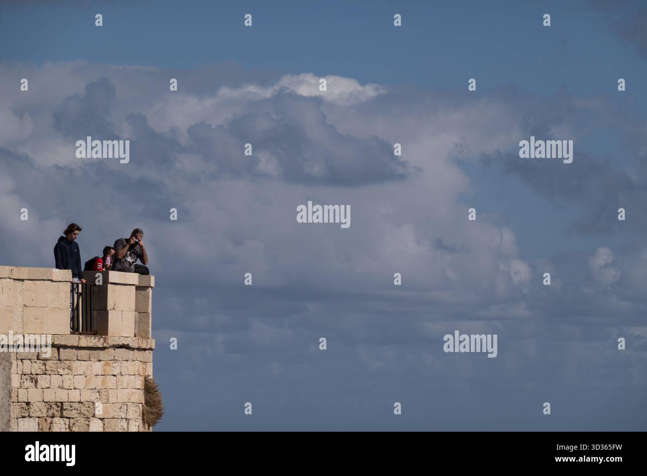 Beachgoers relax by the crystalline sea at Forte San Giovannello in ...