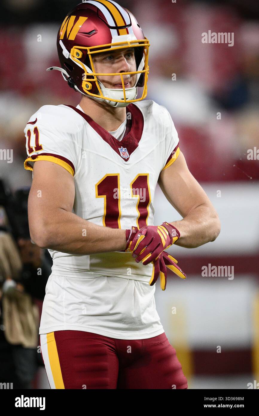 Washington Commanders wide receiver Luke McCaffrey (11) warms up before ...