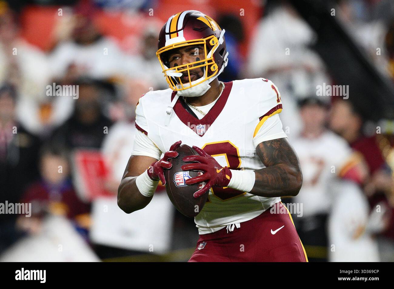 Washington Commanders wide receiver Treylon Burks (13) warms up before ...