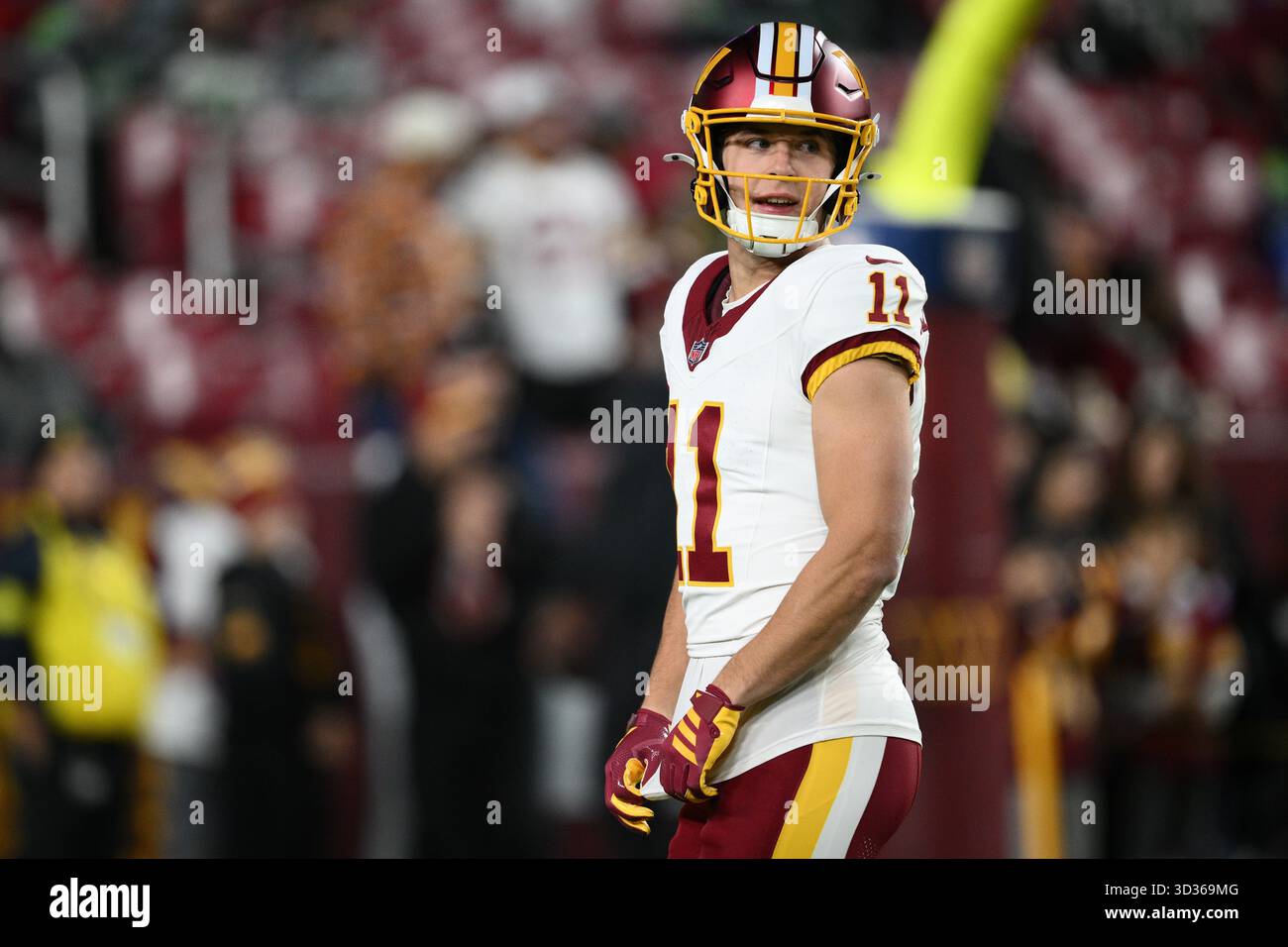 Washington Commanders wide receiver Luke McCaffrey (11) warms up before ...