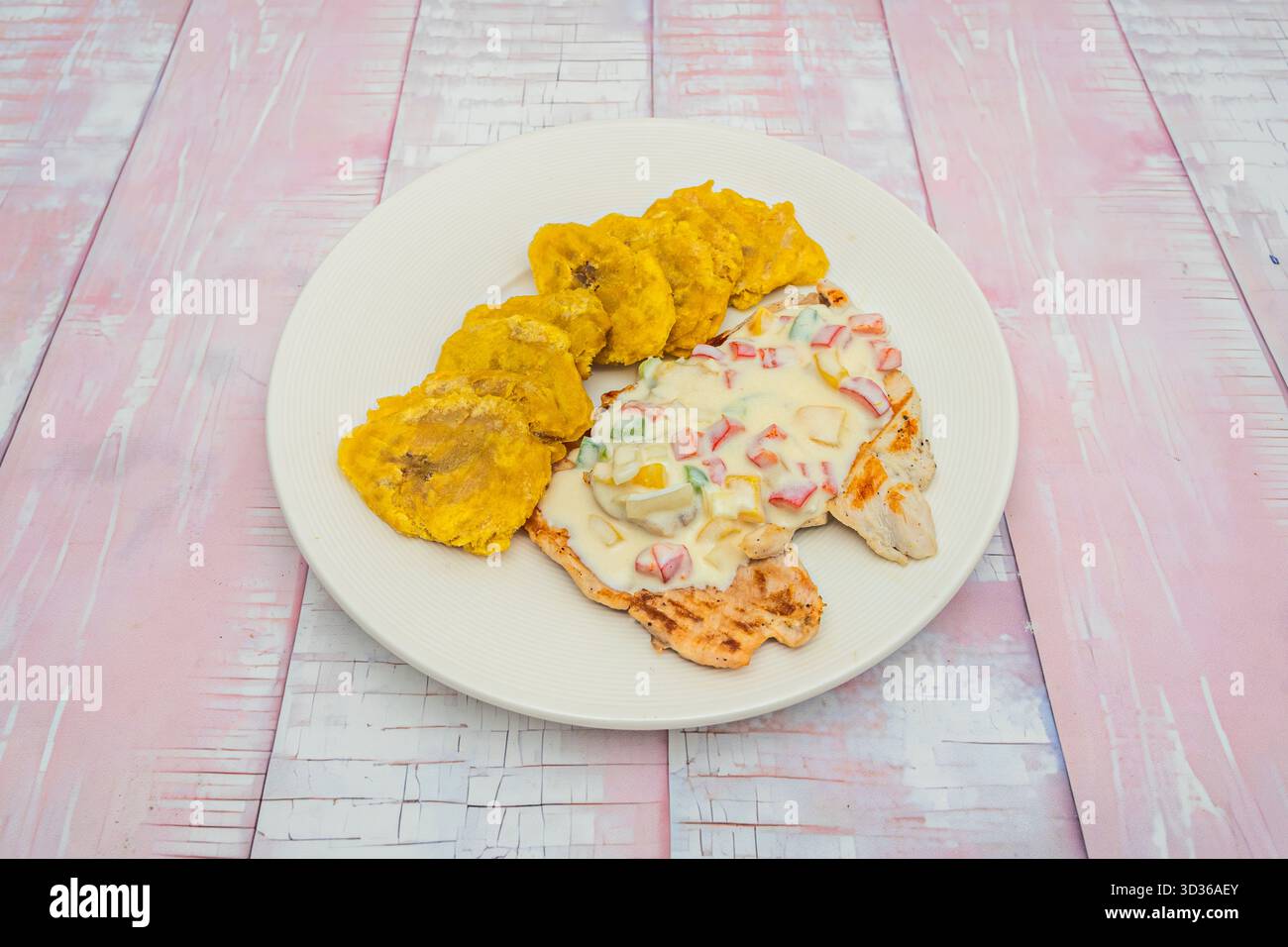 Layers of melted mozzarella cheese, oregano, and slices of ripe Hass ...