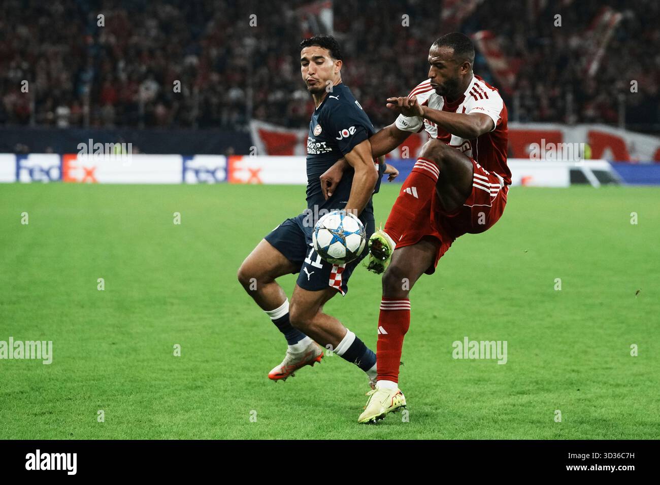 PSV's Couhaib Driouech, left, and Olympiacos' Ayoub El Kaabi vie for ...