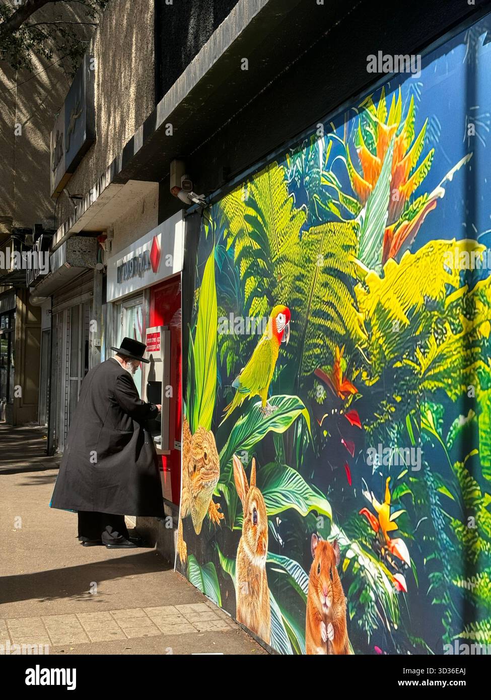 Haifa, Israel, 4 October 2025, An ultra-orthodox jewish man uses an atm ...