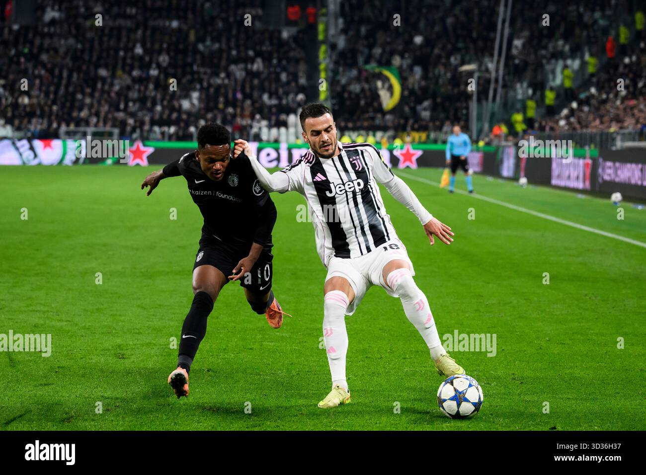 Filip Kostic of Juventus FC competes for the ball with Geny Catamo of ...